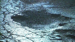 Crews Work To Fix Pothole Problems