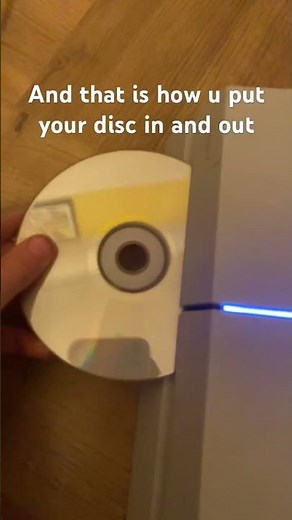 How to put disc on ps4 in and out