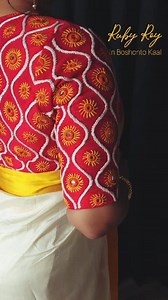 Ruby Roy. A name. A memory. A season. If Ruby Roy walked through Boshonto Kaal, how would she drape herself in its golden glow? I imagined her in an iconic Gorod from Murshidabad, Bengal—its white whispering nostalgia, its yellow echoing spring’s warmth. A magenta raw silk blouse, hand-embroidered, because memories aren’t just sepia—they bloom, they contrast, they linger. Mone Pore Ruby Roy… A song that lingers like an old memory. A name that refuses to fade. Much like Gorod—the silk of Bengal. 