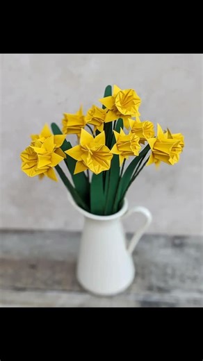 Handmade origami flowers, plants & decorations on Instagram: "🌱 Woo hoo, Spring is springing! I took a little stroll around my garden and spotted daffodil leaves poking up through the soil 😍 Inspired me to make my first origami daffodils of 2026! I'll be delivering these paper flowers to my newest Origami Blooms stockist @artandsoulhub next week, along with lots more zingy Spring blooms. If you're near Leeds, go and take a look - they have so many gorgeous gifts, perfect for Valentine's and Mo
