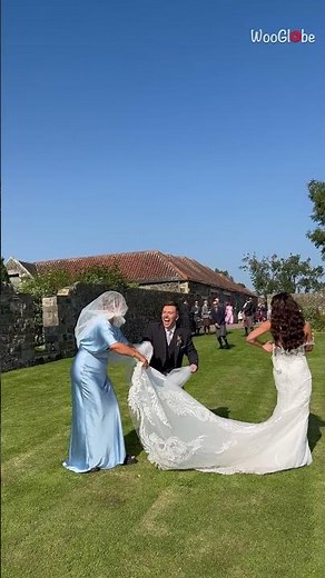 Wind blows bride's veil and it lands directly on bridesmaid’s head || WooGlobe