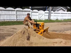 CAT Mini Dozer Pushing Dirt