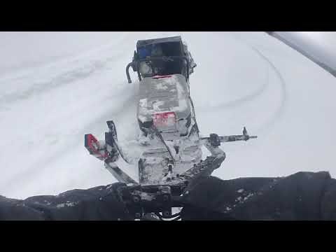 Homemade snowdog/ tracksled ride deep snow