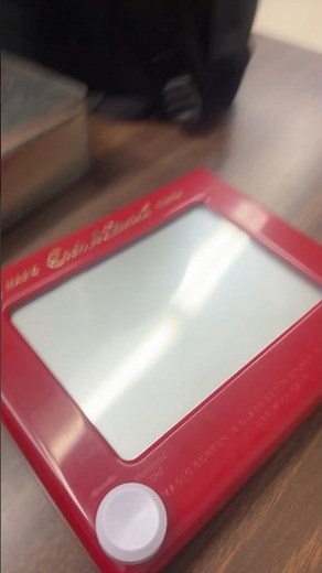 Showing my etch a sketch from Toy story ￼