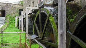 four active medieval overshot waterwheels Chateau de Fougeres (Fougeres Castle), France