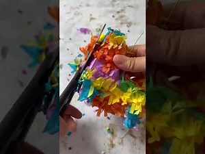 Breaking open a colorful piñata toy
