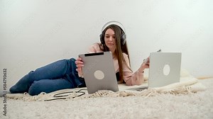 Remote work attractive young female interpreter working from home remotely lying in comfortable living room using modern laptop computer young girl with video call through laptop home office concept
