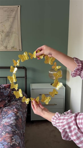 Make an embossed metal butterfly wreath for spring! 🦋 Full tutorial & list of supplies are up on the blog! entertainidea.com #diyproject #artsandcrafts #springcraft #diyspringdecor #springwreath