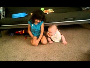 Baby gives sister zerberts!