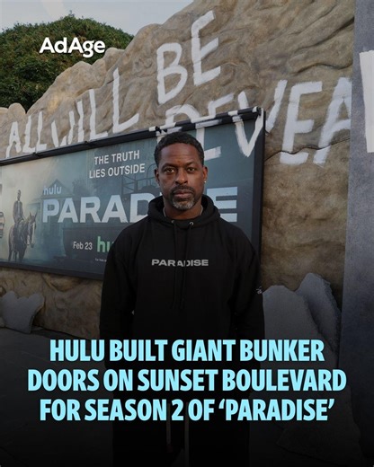 Hulu has installed a massive set of bunker doors on Sunset Boulevard to promote Season 2 of “Paradise,” turning a familiar stretch of road into a timed advertising spectacle. The 16-foot-tall structure spans more than 100 feet across and sits beneath a digital clock that resets every 10 minutes. When the timer hits zero, the doors swing open to unveil a rotating promotional moment tied to the series, reframing the show’s underground setting as something that can’t be missed above ground. Sterlin