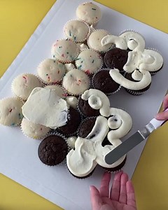 Nailed it! This construction-themed cupcake cake by the Kansas-based baker Cara Pile of September Moon Cupcakery was inspired by Meri Meri's adorable Dumper Truck party supply design. “I frosted all the cupcakes as one big cake and then they are pulled apart and eaten as individual cupcakes when it’s time to enjoy,” says Pile. “It’s a creative cake idea that requires no slicing!” Browse our Party Shop for construction-themed supplies that your kids will really dig: https://bit.ly/3ole8Jv | Paper