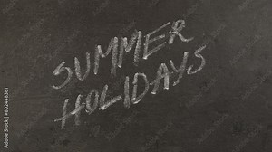 Summer Holidays. Hand writing with chalk on chalkboard. 4K Stop motion animation.
