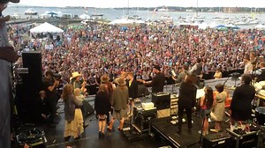 From Newport Folk Festival this past weekend. David Rawlings, Gillian Welch, Brandi Carlile, Dom Flemons, Lucius, Béla and Abigail Washburn, and others joined The Decemberists on stage to play "This Land Is Your Land." | Béla Fleck