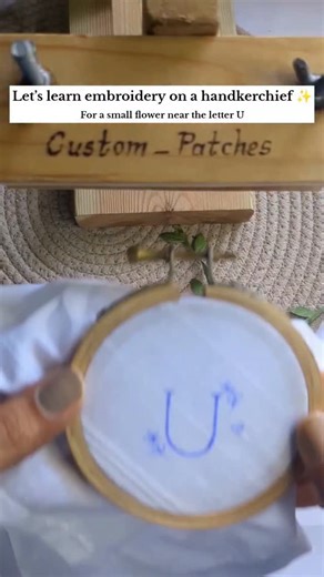 Embroidery 🪡 on Instagram: "Turning a plain handkerchief into something elegant & personal 💛 Learn how to make this floral ‘U’ initial embroidery — perfect for gifting or keeping for yourself! 🌼 Each stitch made with love 💕 DM to order your own customised hanky 🌸 #handembroidery #customembroidery #embroiderytutorial #embroideryreel #handkerchiefembroidery #initialembroidery #chainstitch #frenchknot #embroideryart #stitchbystitch #handmadegift #madewithlove #embroiderydesign #smallbusinesssu