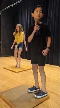 HMS students crack each other up pretending to play fiddler's convention. #flatfoot