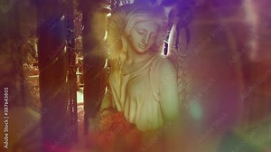 Figure of a praying angel. A very ancient stone statue. Death. Sad angel as symbol of pain, fear and end of life.