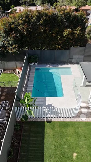 Our palmwoods project featuring a custom knottwood pool fence and beautiful travertine tiles 😍 | Bravo Built