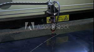Laser cuts numbers and letters for car numbers on plastic with double-sided tape. Production of 3D numbers for cars. Focused, computer-controlled laser beam provides a high concentration of energy an
