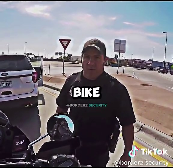 Biker Challenges Cop Over Texting While Driving