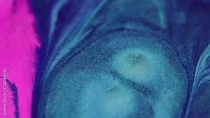 Glitter fluid texture. Paint splash. Defocused pink blue color shimmering particles acrylic ink mix flow motion abstract background.