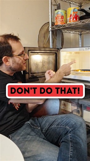 You should never reheat a slice of pizza in the microwave. To prove why, I cut a large New York slice in half to compare two different methods: the common microwave “nuke” and the right way. Method 1: The Microwave (What NOT to Do) The Process: Microwaves work by heating up the water molecules inside the pizza. This generates steam, which is the absolute enemy of crispy pizza. You end up with a soggy, soft, and tough crust. When you listen to it, the slice is completely silent—there is zero crun