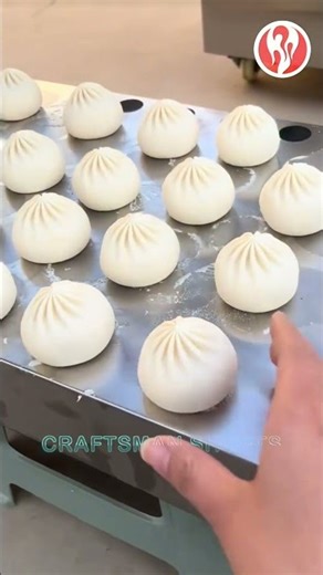 Steamed Buns | The machine making steamed buns is running.