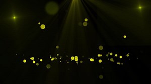 Golden Particles Floating in Dark Background with Light Beams