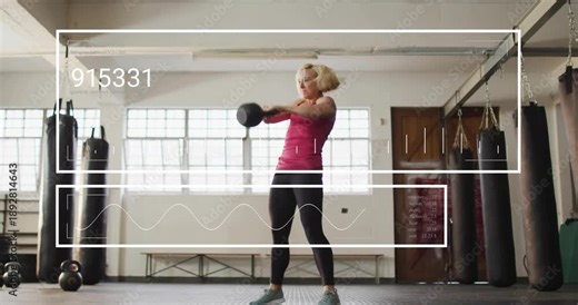 Woman doing kettlebell swings in gym hinging hips and driving it overhead UI counters tracking reps