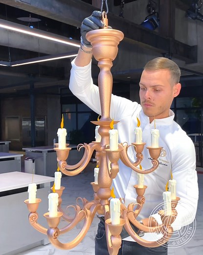 Taking chocolate to new heights — literally! This was my very first time crafting a chocolate chandelier hanging from the ceiling, and I couldn’t be happier with how it turned out. My favorite part? The little chocolate flames flickering on top of each candle! | Amaury Guichon