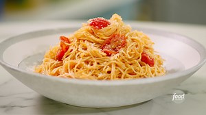 Cream and cherry tomatoes create an easy, vibrant sauce for Alex Guarnaschelli's quick pasta dinner that'll def become a go-to! 🍅🍝 Watch #TheKitchen, Saturdays @ 11a|10c and subscribe to discovery to watch more episodes: https://links.discoveryplus.com/aWGKoY3dygb. #discoveryplus Get the recipe: https://foodtv.com/3Ab0qcF. | Food Network