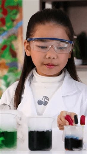 clip-4008776847-asian-student-wearing-safety-goggles-uses-pipette