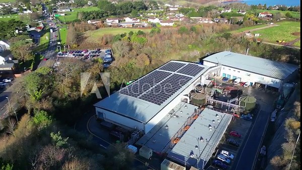 Churston, Devon, England: DRONE VIEWS: A sewage treatment plant with solar panels on its roof; the panels power sewage treatment in the plant. Solar power is part of the 2030 net zero initiative.