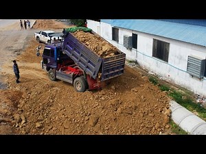 Small Bulldozer Working Pushing Dirt And Rock - Mini Dump Truck Unloading Gravel And Dirt