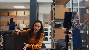 Young owner doing teleshopping ad for internet promotion, showing products on streaming platform channel for small business development. Entrepreneur advertising merchandise on video.