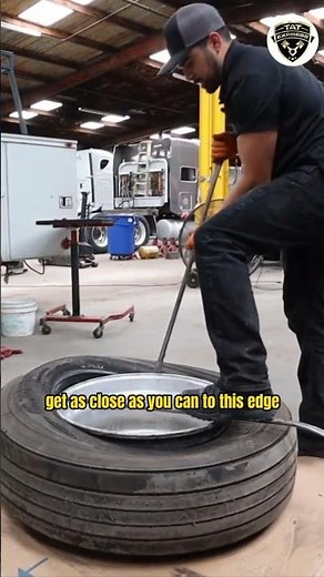 Removing a semi truck tire from the rim.
