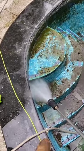 Power washing a swimming pool