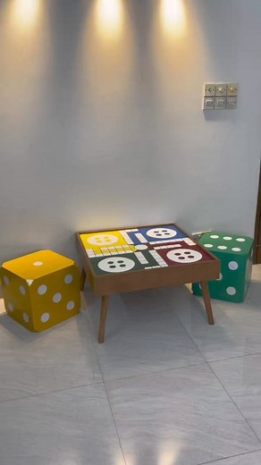 Ludo Party 🎲 Introducing our Ludo Party table. This can be used as a coffee table as well as a real ludo board. How exciting is that? The ludo table comes with a set of ludo guti( token) and a dice for you to play with your friends and family. You may pair it up with our best selling chokka seaters in any color you like. This could make a cozy and fun corner for your lovely home. Imagine having game nights at your place! Fun right? Order yours today! Let us know how you like our ludo party tabl