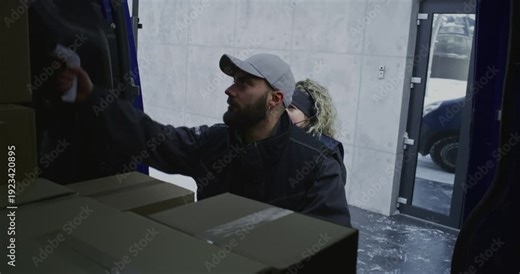 Team Arrives Address Deliver Packages From Blue Van. Couriers Check Digital Inventory With Tablet and Scanner. Woman Contacts Owner Via Doorbell While Man Delivers Parcels. Real Life Winter Logistics.
