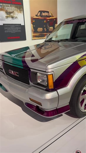 This is the 1991 GMC Syclone PPG pace truck. It was built as a pace vehicle for the IndyCar World Series and used at many venues. The Syclone featured a turbocharged 4.3L V6 engine, all-wheel-drive, and was known for its exceptional acceleration. Only 2,995 units of the standard Syclone were produced in 1991, making them highly collectible. This specific truck cannot be driven on public roads as it was sold on a scrap title. Shown at the Petersen museum part of the 80s-90s exhibit. #tiktokcaroft