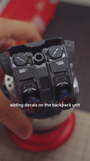 Applying decals to the backpack after a gloss coat lets them sit on a smoother surface, so they slide easier, adhere better, and avoid that grainy silvering you get on flat paint, aaaand I didn't do that here 😅 #gundam #gunpla