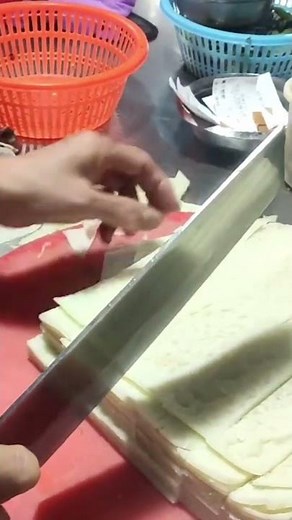 cut the steamed fishcake dough into rectangles and then skewer them with bamboo