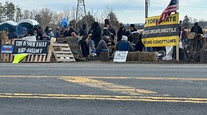 Corrections officers continue strike despite tentative agreement