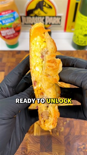 Eggs, cheese, bacon, tots, and my quick breakfast sauce all wrapped up warm and crispy. Super easy to make and absolutely hits for breakfast. #breakfastideas #easyrecipes #familyfood #cookandconquer | Ryan Tyler Cooks