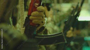 Group of Soldiers or Special Forces Loading weapons and installing Magazine Before Fight . Military , war or strike ball theme concept . Shot on ARRI Alexa cinema camera in Slow Motion . Close up view