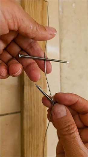 Tighten loose wire with this simple method with just two nails