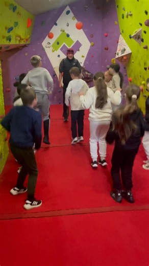 Group 1 warming up at the climbing wall. | St. Joseph's Catholic Primary School - Washington