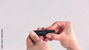 Women's hands uses a diabetes lancing device with 9 depth adjustment options to minimize injury and reduce pain. Portable and easy to carry. Diabetes diagnostic kit