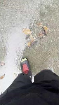 Firefighter boots wade through rain puddles