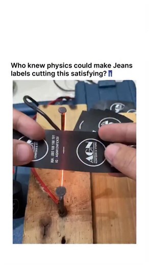 picpac19 on Instagram: "This video demonstrates a fascinating and practical DIY approach to cutting business cards using an electrified, glowing resistance wire. Suspended between two large nails driven into a wooden block, the thin wire is heated until it glows bright orange, acting as a precision thermal blade. The person in the video carefully slides printed black business cards across the wire, which melts or burns through the material instantly, leaving a clean, straight edge. This method i