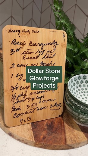 WHICH IS YOUR FAVE? I used the @glowforge Aura Craft Laser to transform three items from everyone’s favorite dollar store, and I want to know which you like best! 🧡 ENGRAVED CUTTING BOARD: my grandma’s beef burgundy recipe is now a sweet keepsake, thanks to the Aura’s ability to trace and engrave handwriting. 🧡 CUSTOM BASKET TAG: The Glowforge app’s library of images came in handy for engraving a cute pup’s face, and then cutting a circle and my dog’s name to create a labeled basket for all of